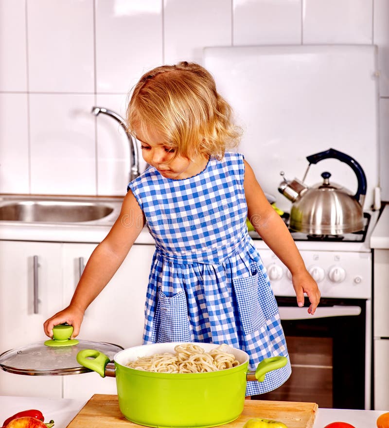 Child cooking at kitchen. stock image. Image of cheese - 67934269