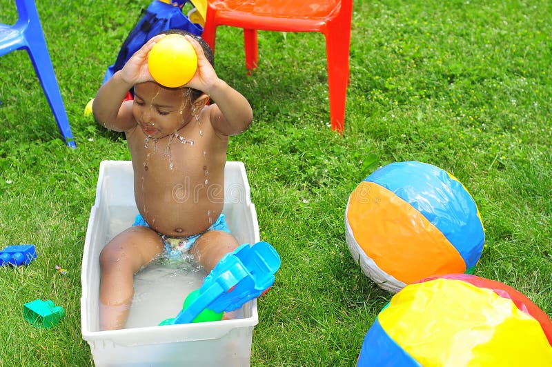 Child Cooling Off with Water Stock Photo - Image of toys, child: 14846230