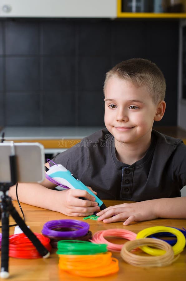 Child Creating with 3d Printing Pen. Happy Boy Does Something with ...