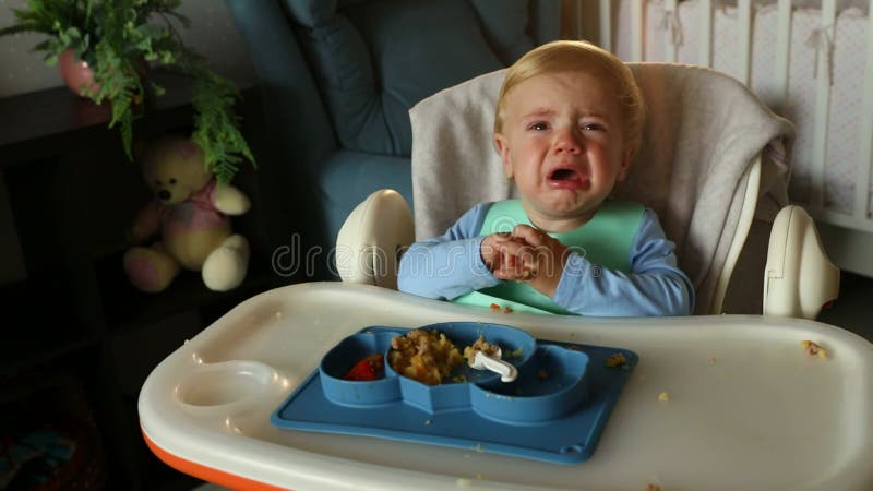 Child Cries and at the Same Time Looks at Himself in the Mirror. Baby ...