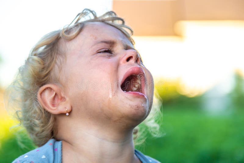 A Child is Crying on the Street. Selective Focus Stock Image - Image of ...