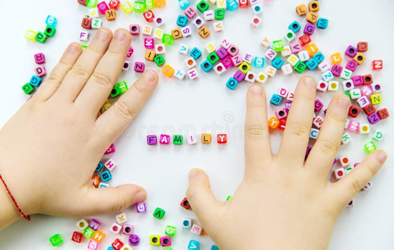 Child Cubes and the Word Family. Selective Focus Stock Photo - Image of ...