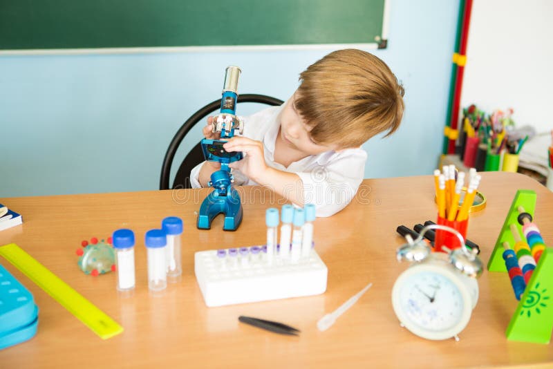 Child with Curiosity during a Medicine Fair Looking at Bacteria through ...