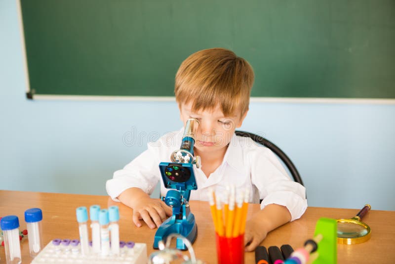 Child with Curiosity during a Medicine Fair Looking at Bacteria through ...
