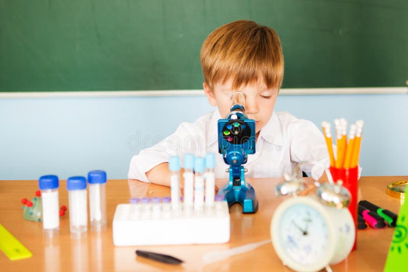 Child with Curiosity during a Medicine Fair Looking at Bacteria through ...