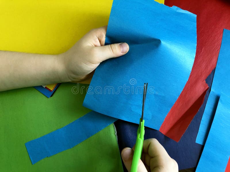The Child Cuts Colored Paper with Scissors Stock Image - Image of ...