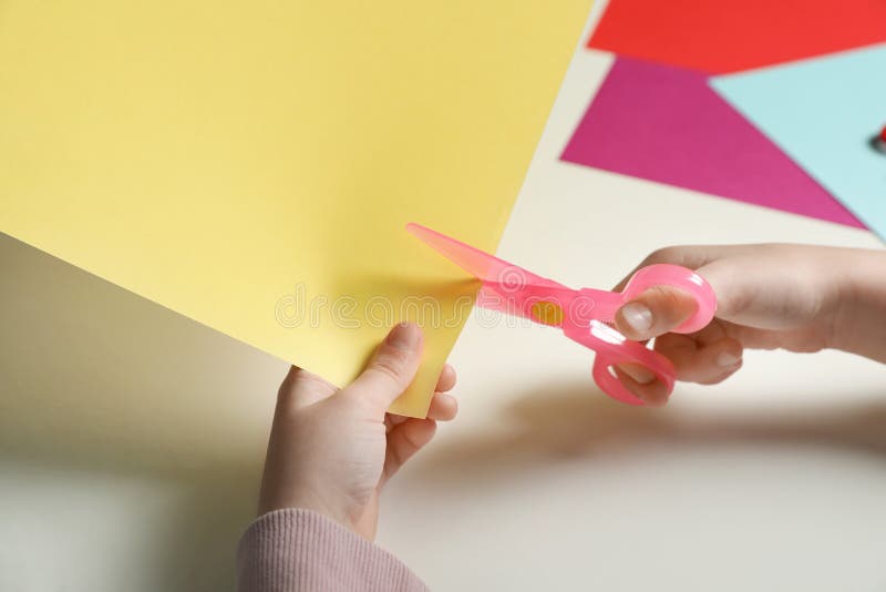 Child Cutting Color Paper with Plastic Scissors at Table, Stock Image ...