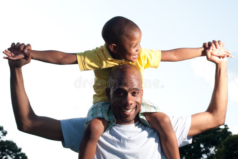 Child on dad s shoulders stock photo. Image of child - 10366026