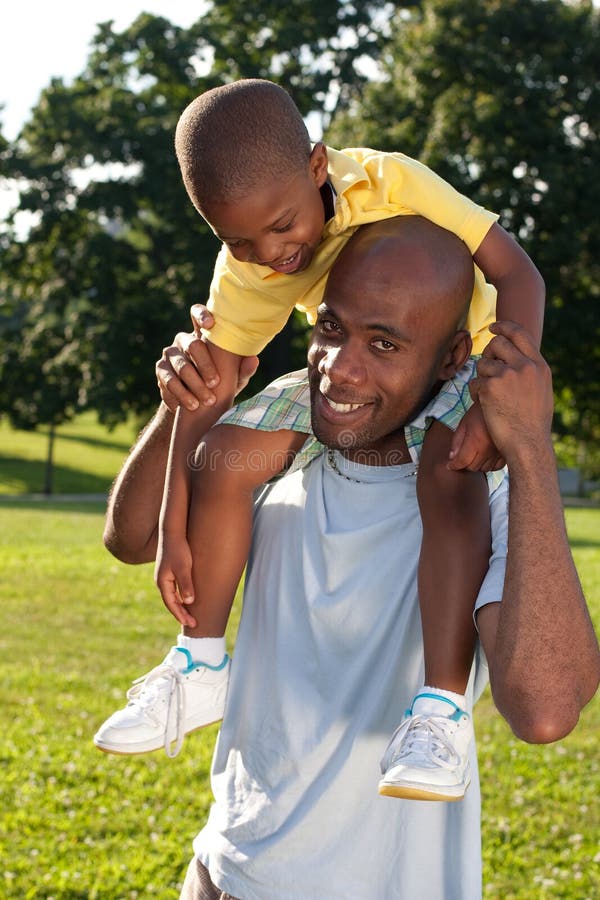 Child on dad s shoulders stock photo. Image of child - 10366026