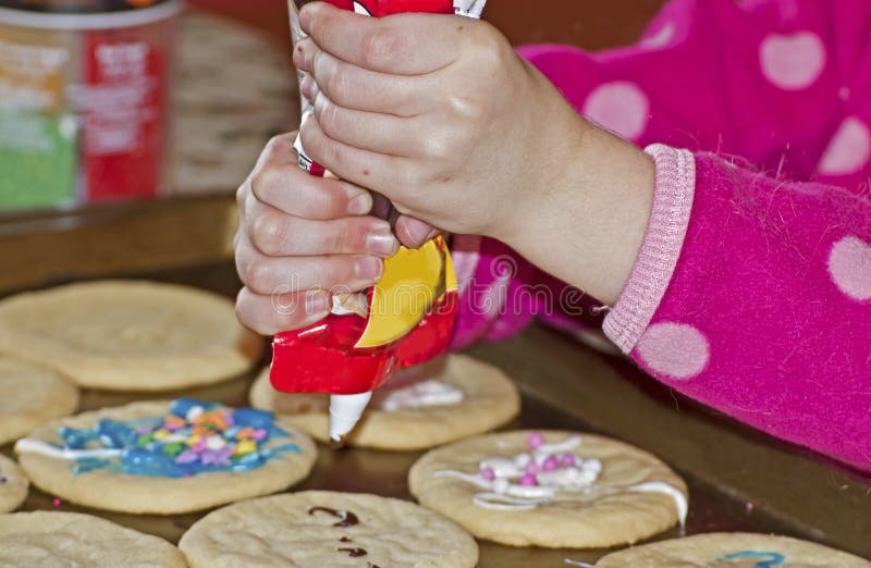 Child Decorating Cookies stock photo. Image of seasonal - 28065428
