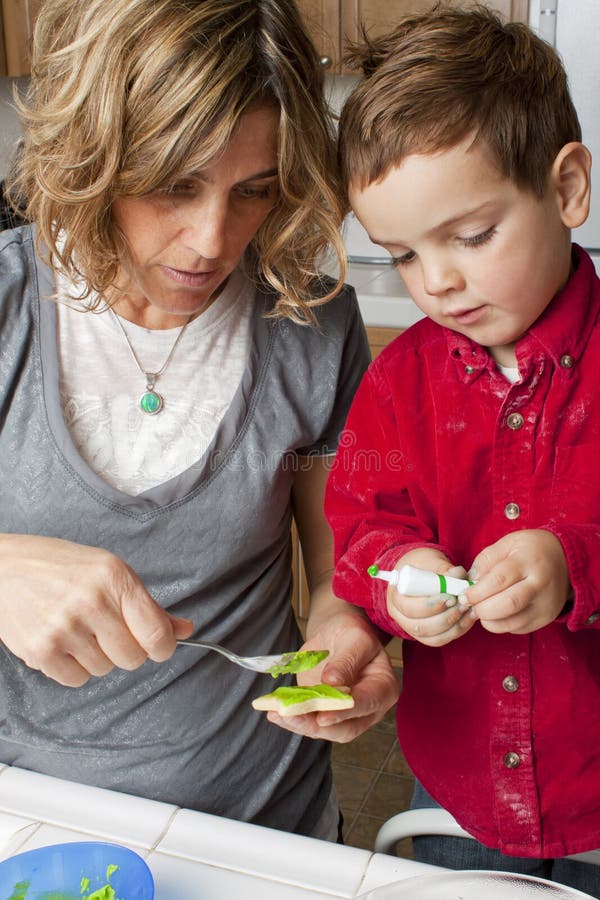 Child Decorating Cookies with Mom Stock Photo - Image of baking ...