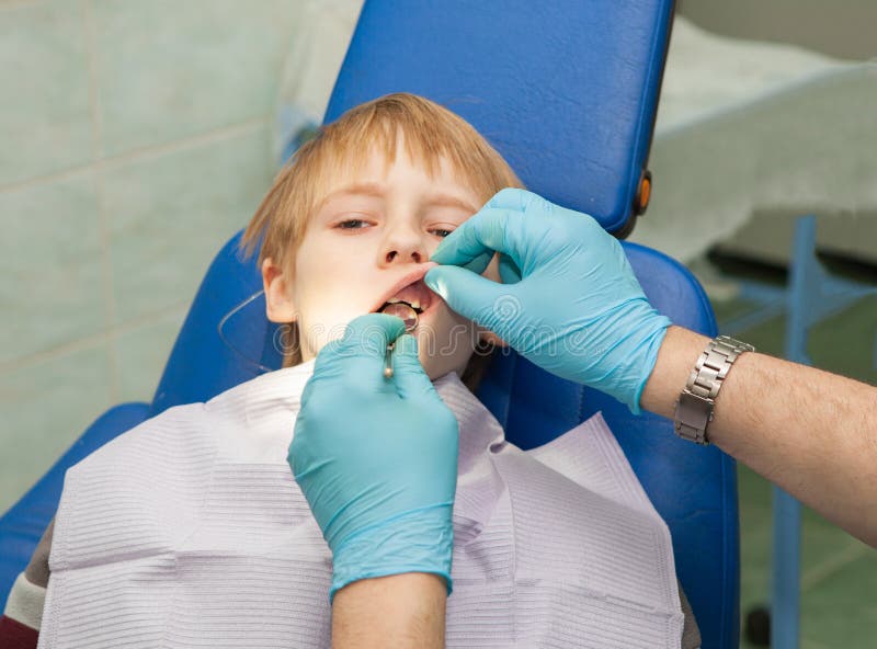 Child at dental check up. stock image. Image of mirror - 61743857