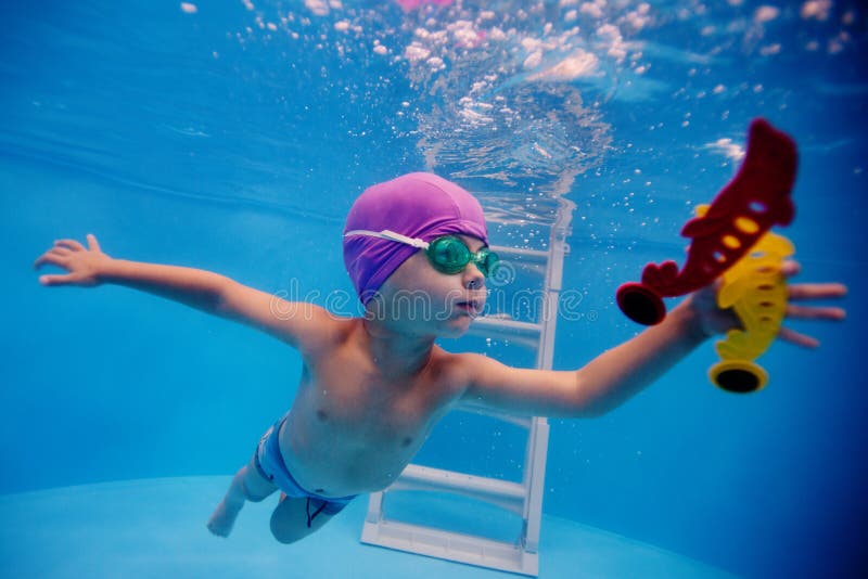 Child Dives into the Pool for a Toy Stock Image - Image of lifestyle ...