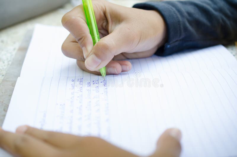 Child Do His Homework. Notebook for Mathematic. Hand Hold Pen Stock ...