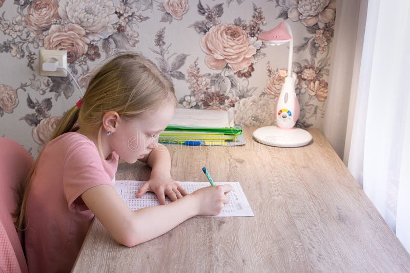 The Child Does Homework Lessons at the Table Stock Image - Image of ...