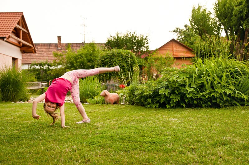 Child doing cartwheel stock image. Image of garden, lifestyle - 20472019