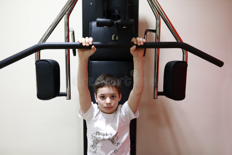 Child Doing Exercises for Back Load on Simulator Stock Image - Image of ...