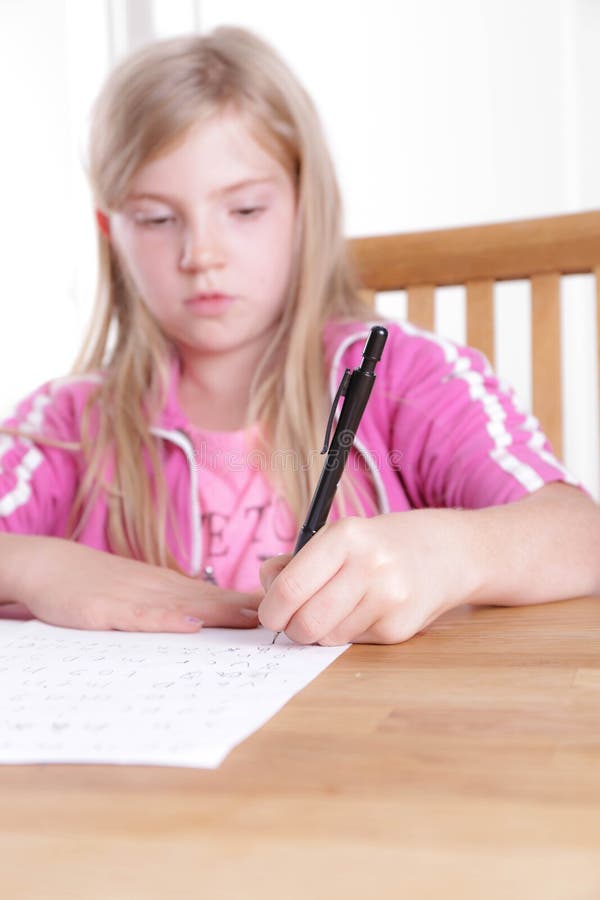 Child doing her homework stock photo. Image of girl, sitting - 33704870