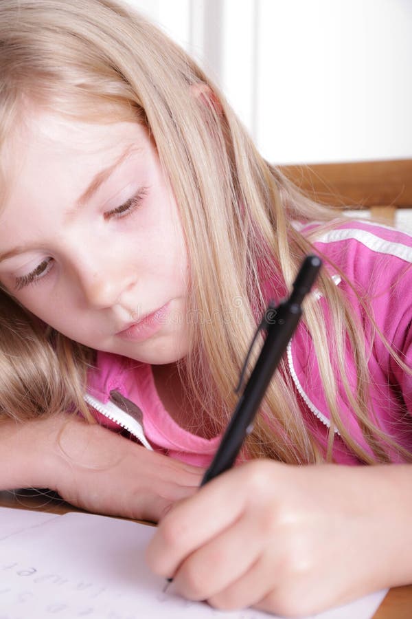 Child doing her homework stock photo. Image of homework - 33704882