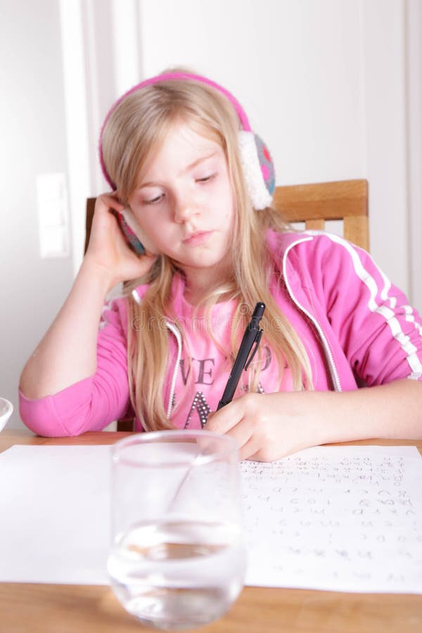 Child doing her homework stock photo. Image of kitchen - 33704884