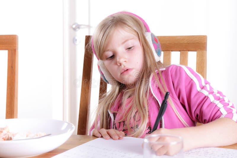 Child doing her homework stock photo. Image of homework - 33704888