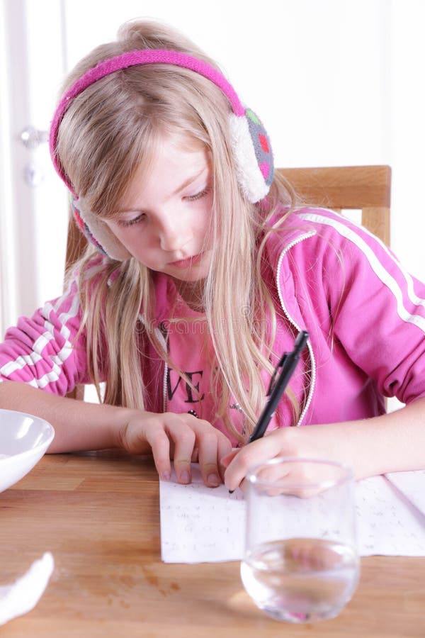 Child doing her homework stock photo. Image of homework - 33704892
