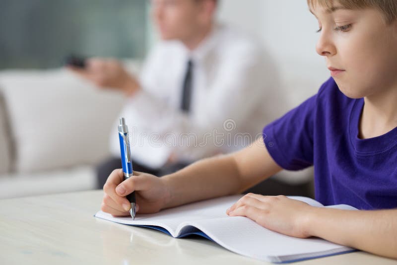 Child doing homework alone stock image. Image of person - 53858915