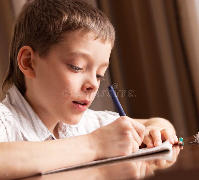 Child doing homework stock image. Image of elementary - 47073165