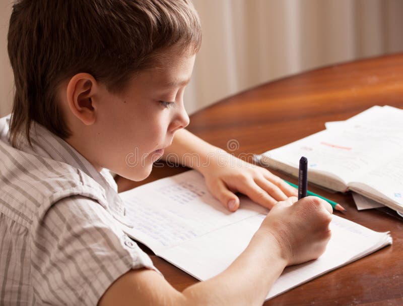 Sad kid doing homework stock image. Image of paper, girl - 34383025