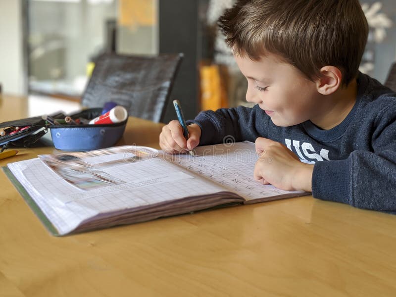 Child Doing Homework on the Kitchen Table Stock Image - Image of ...