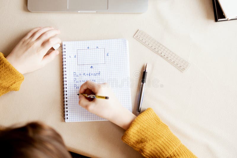 A Child Doing School Homework in a Notebook Stock Image - Image of ...