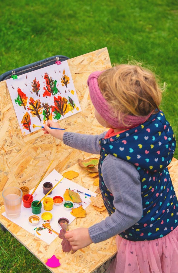 Child Drawing Autumn Leaves. Selective Focus Stock Image - Image of ...