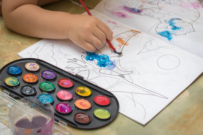 Child drawing with brush stock image. Image of green - 171991427