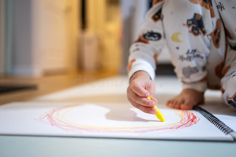 Child is Drawing a Circle with a Yellow Crayon Stock Image - Image of ...