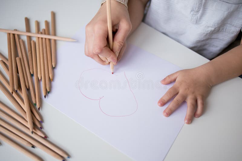 Child Drawing Heart with Pencils on Paper Stock Photo - Image of color ...