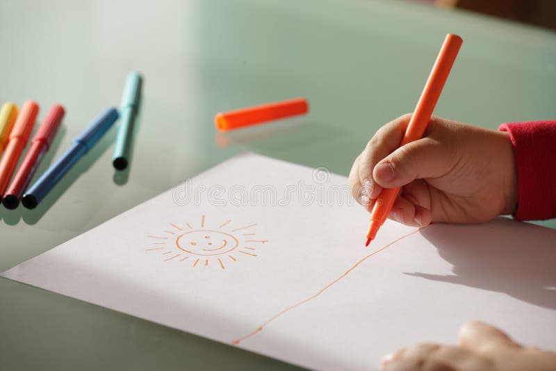 Child Drawing a Sun with Colorful Markers Stock Image - Image of ...