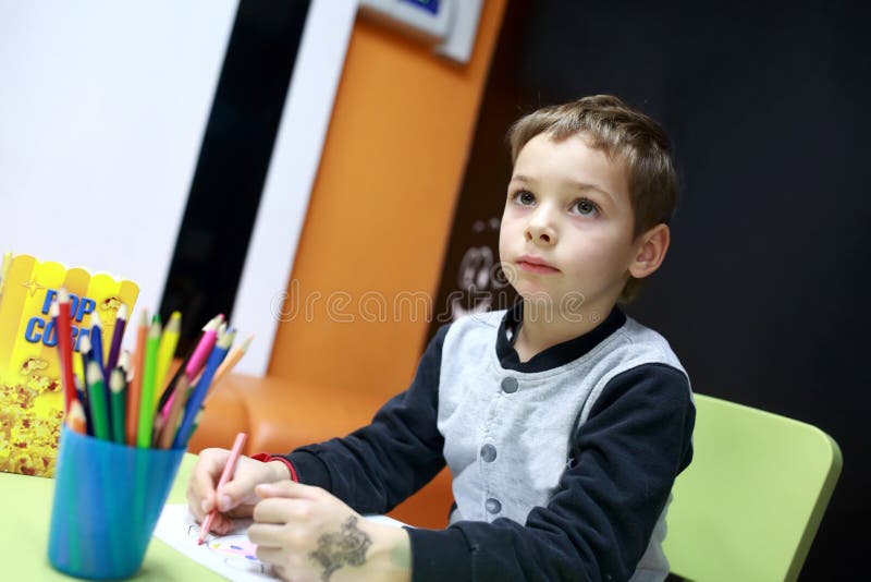 Child drawing at table stock photo. Image of education - 103188868