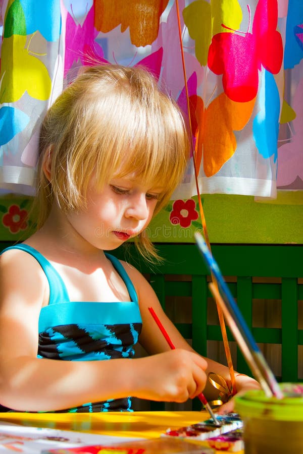 Child Drawing Using Felt-tip Pen while Sitting at Table Stock Image ...