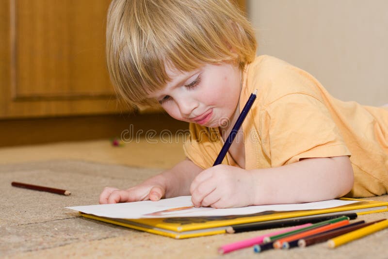 Child draws stock image. Image of focused, happy, lips - 9188391