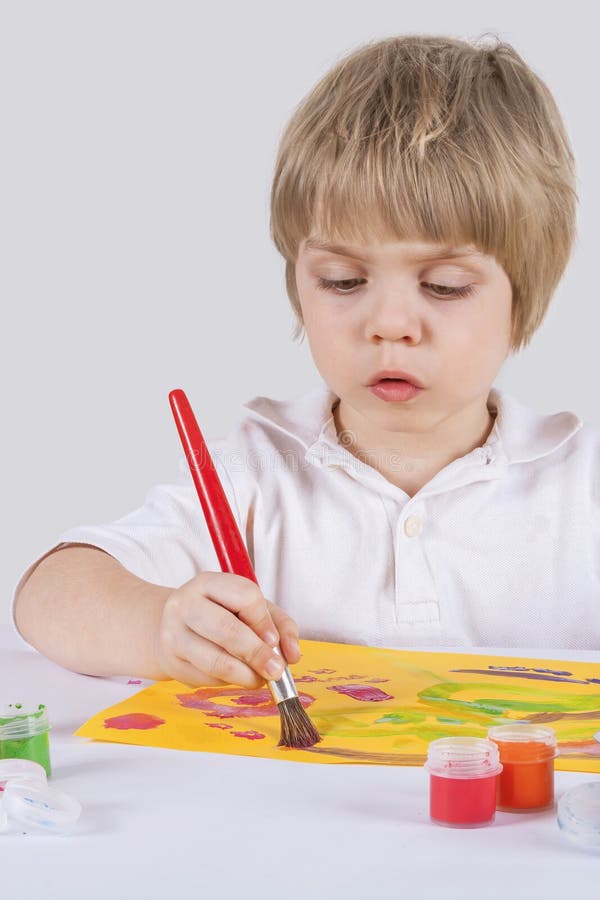 Child Draws with Paints. Big Red Paintbrush in a Hand Stock Photo ...