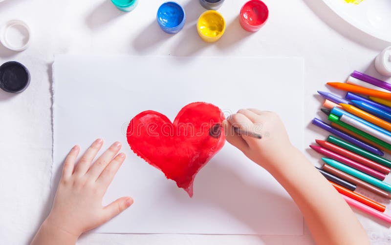 A Child Draws Red Heart with Colored Paints on the Paper Stock Photo ...