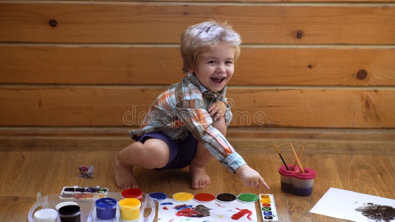 Child Draws. a Child`s Drawing Inks, Finger Paints, Hand Prints. Stock ...