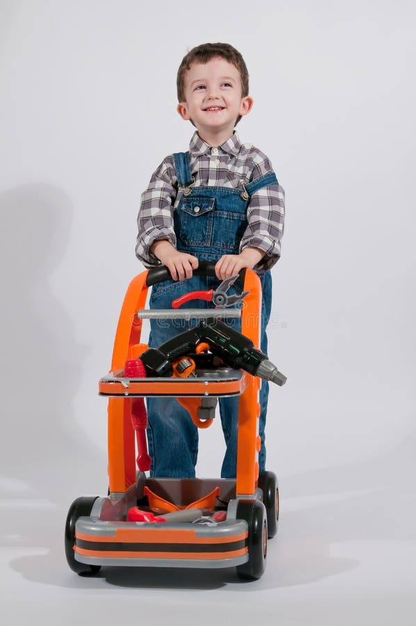 Child Dressed As a Worker with Cart Tools Stock Photo - Image of ...