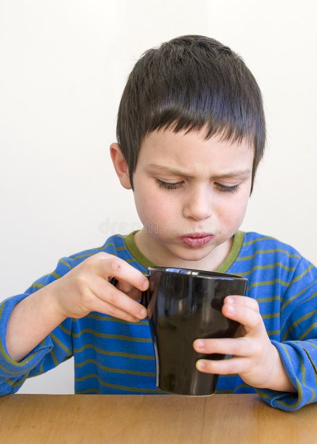 Child drinking cup of tea stock photo. Image of drink - 53550442