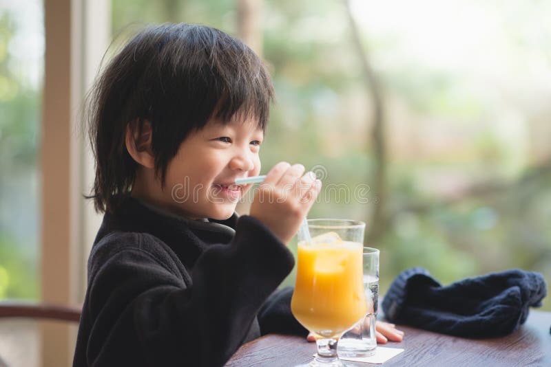 Child Drinking Fresh Orange Juice Stock Image - Image of juice, japan ...