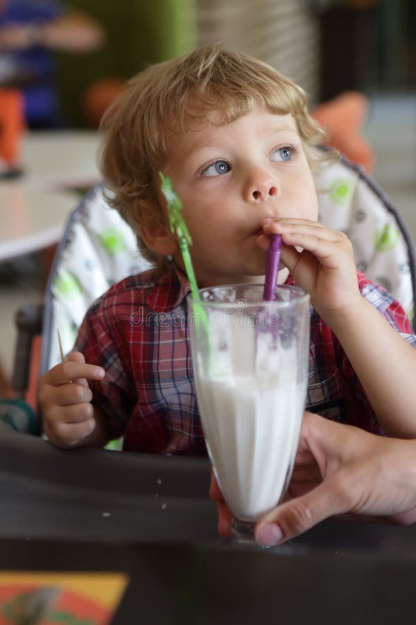 Child drinking milk shake stock image. Image of life - 97702473