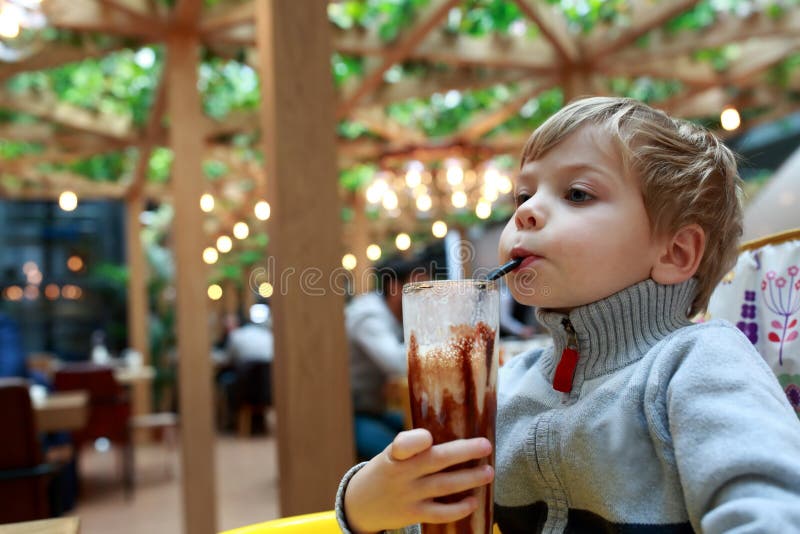Boy drinking milk shake stock image. Image of liquid - 102109075