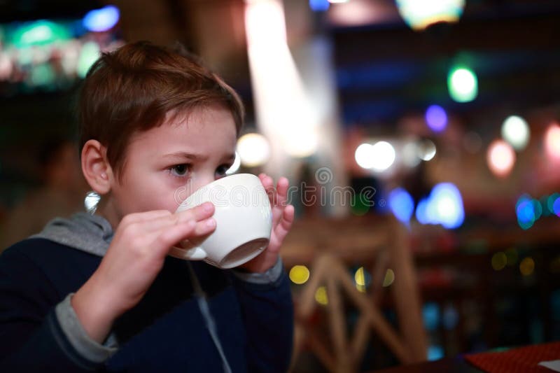 Child drinking tea stock image. Image of childhood, liquid - 105631451
