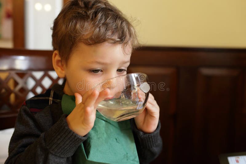 Child drinking tea stock image. Image of enjoyment, drink - 42037081