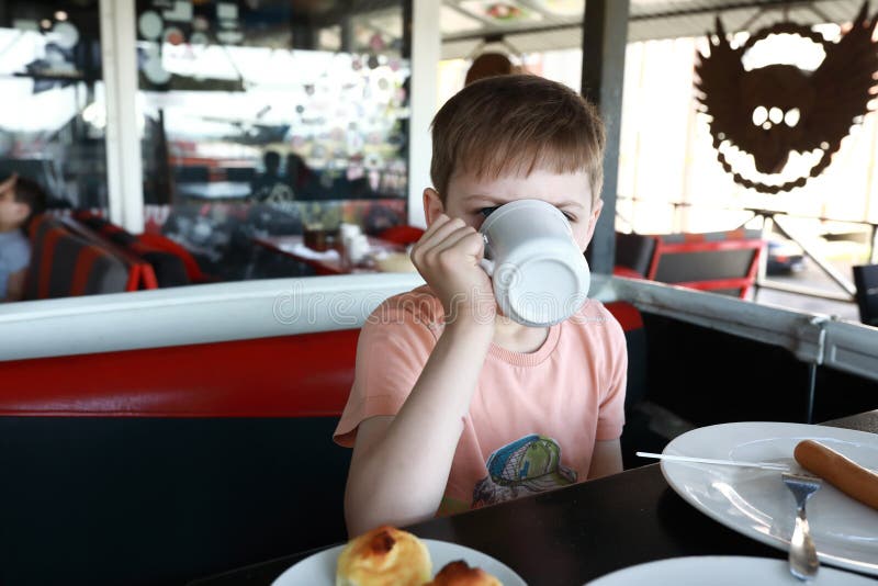 Child Drinking Tea in Restaurant Stock Photo - Image of childhood ...